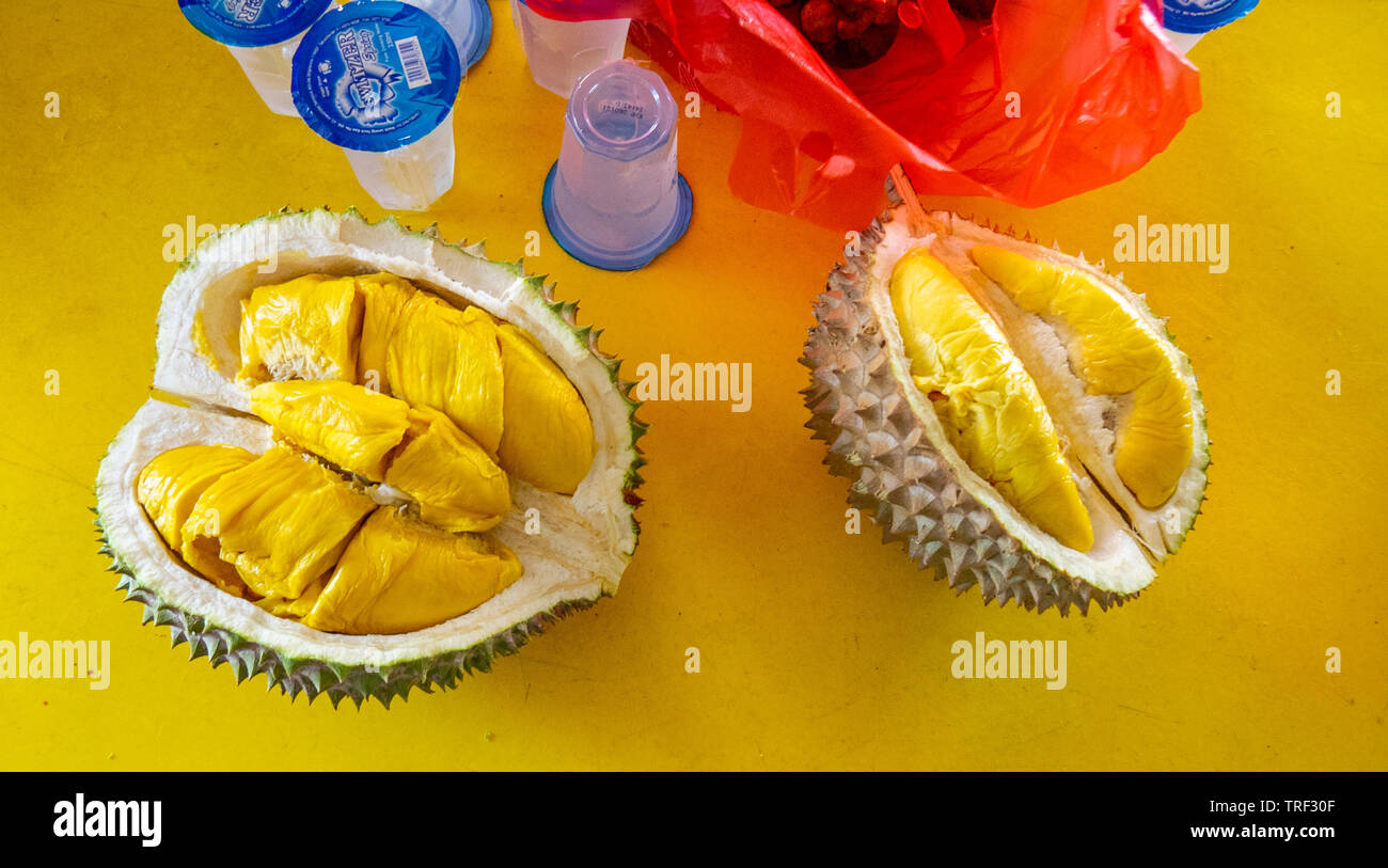 Tropical fruit durian sliced ready to be eaten Stock Photo - Alamy