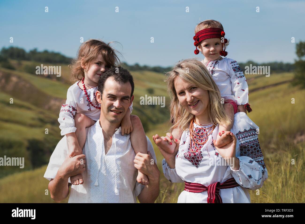 Ukrainian family at the outdoor. dad, mom and two daughters in ...