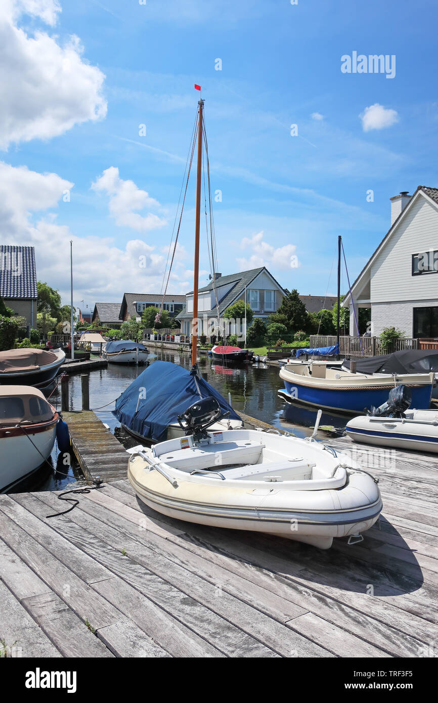 Boats in a urban situation on kaag island Stock Photo - Alamy