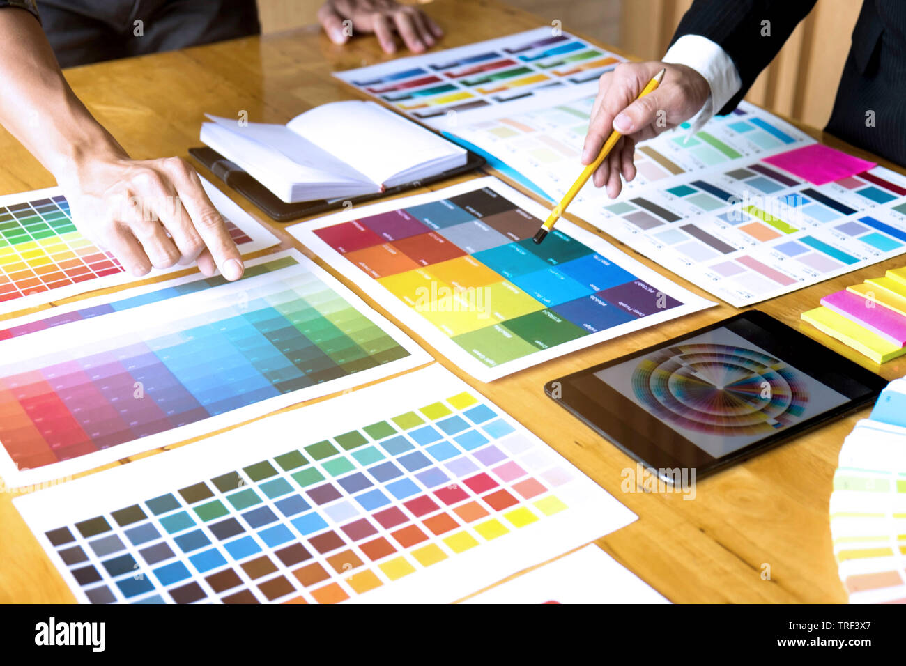 Graphic designers choose colors from the color bands samples for design ...