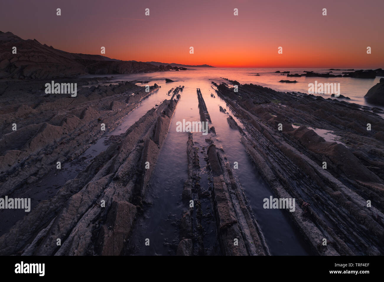 Beach of Itzurun at Zumaia with the famous flysch coast, Basque Country ...