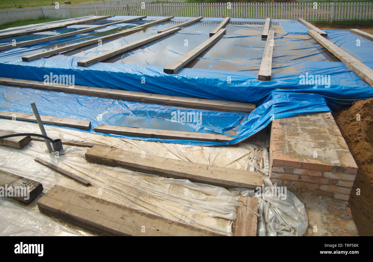 Basement of a house protected with plastic cover seemingly abandoned ...