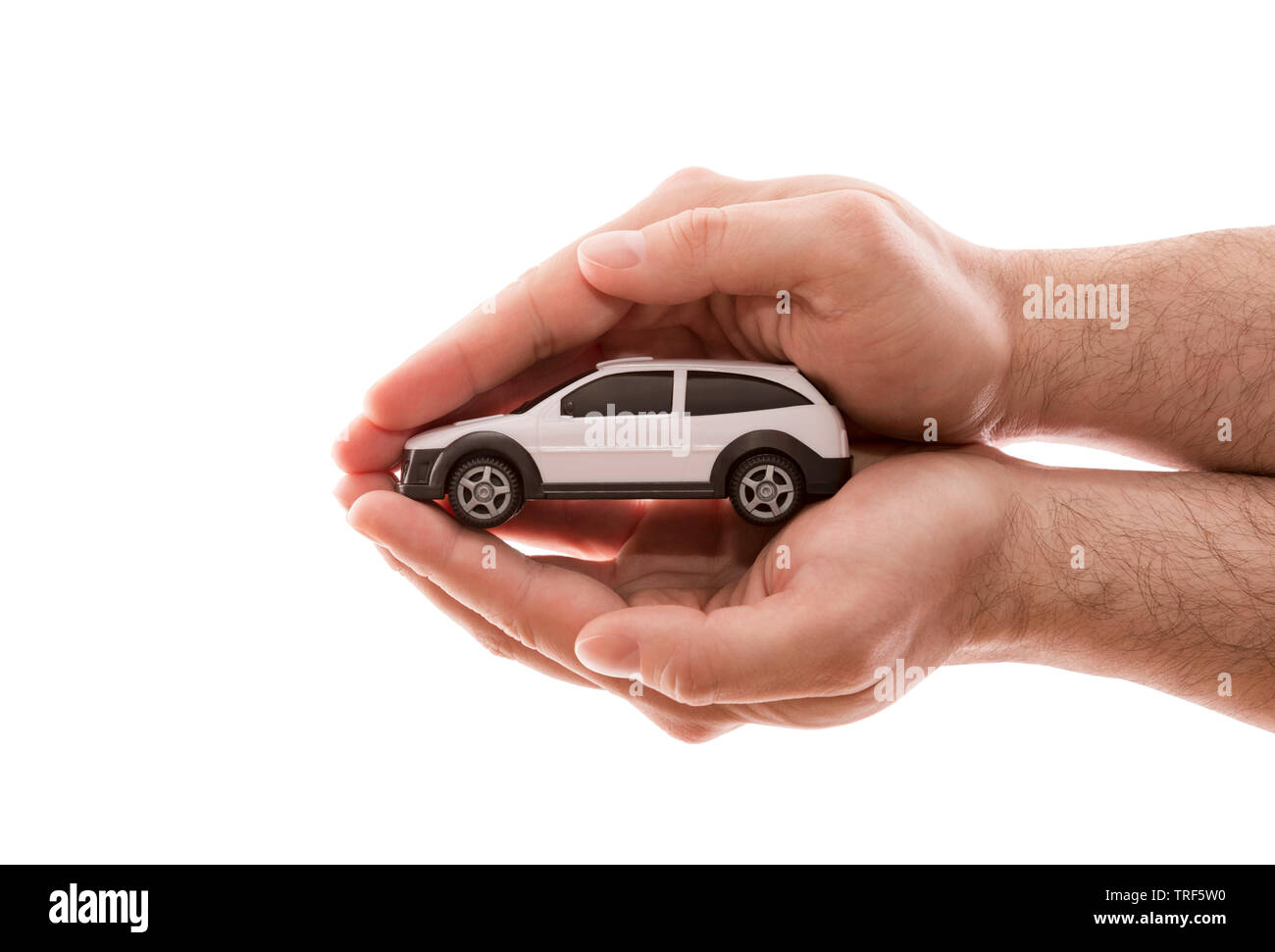 Car protection. Small white car covered by hands isolated on white ...