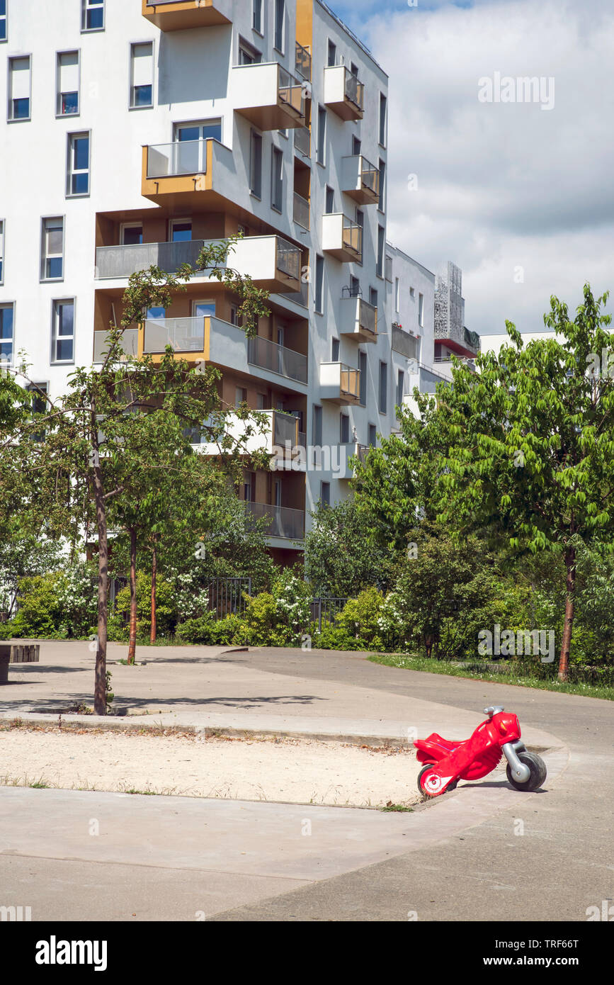 Modern building with vegetation and a playground for children, in Massy ...