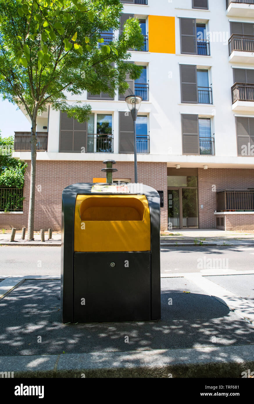Waste bins in a city centre of Massy in France in front of a building ...