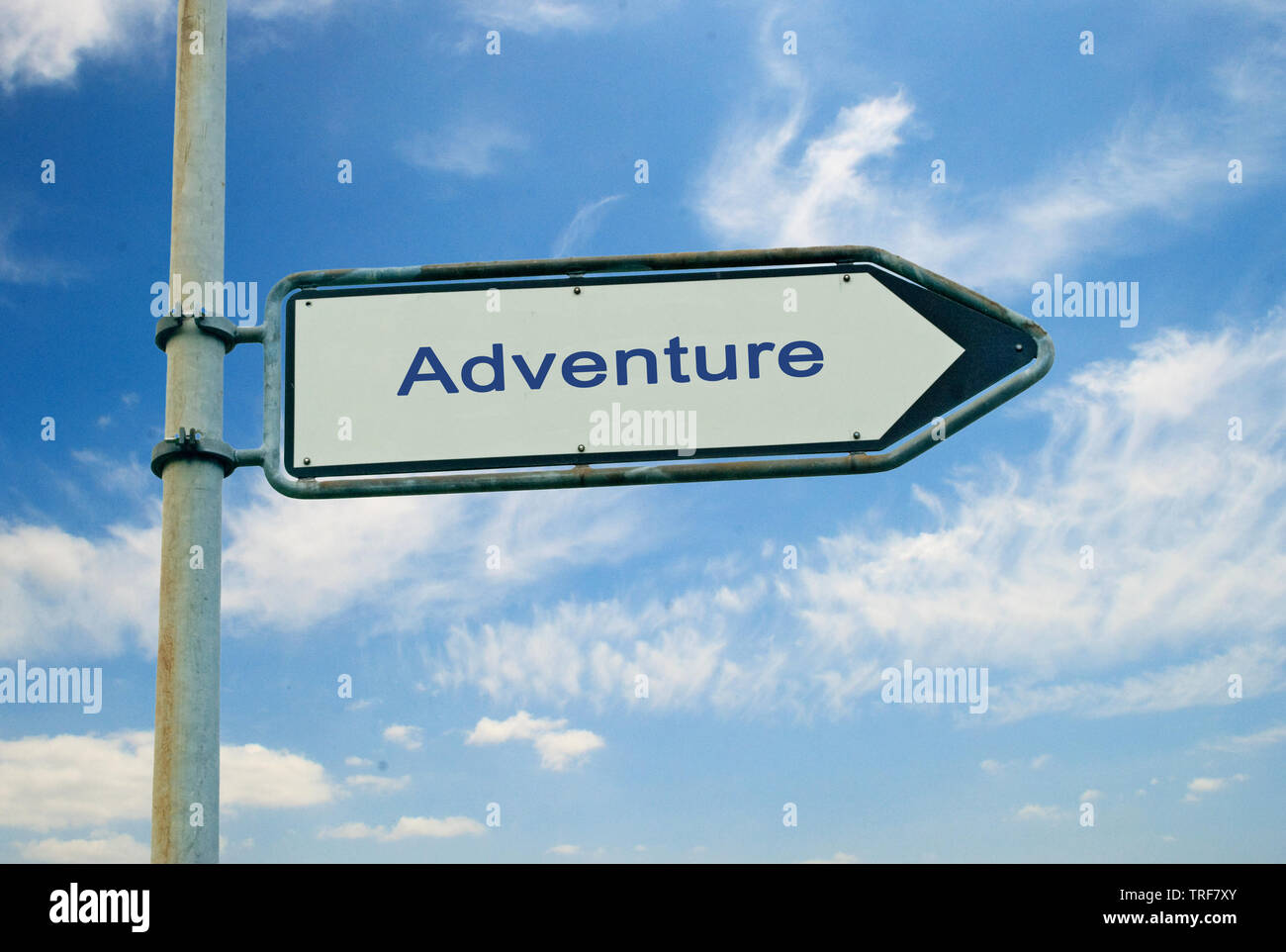 Road sign to adventure Stock Photo - Alamy