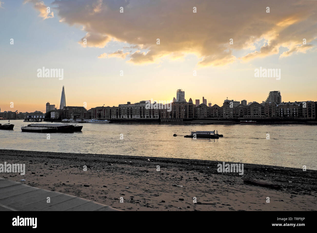 View of the Shard, riverside homes, barges on River Thames and City of ...