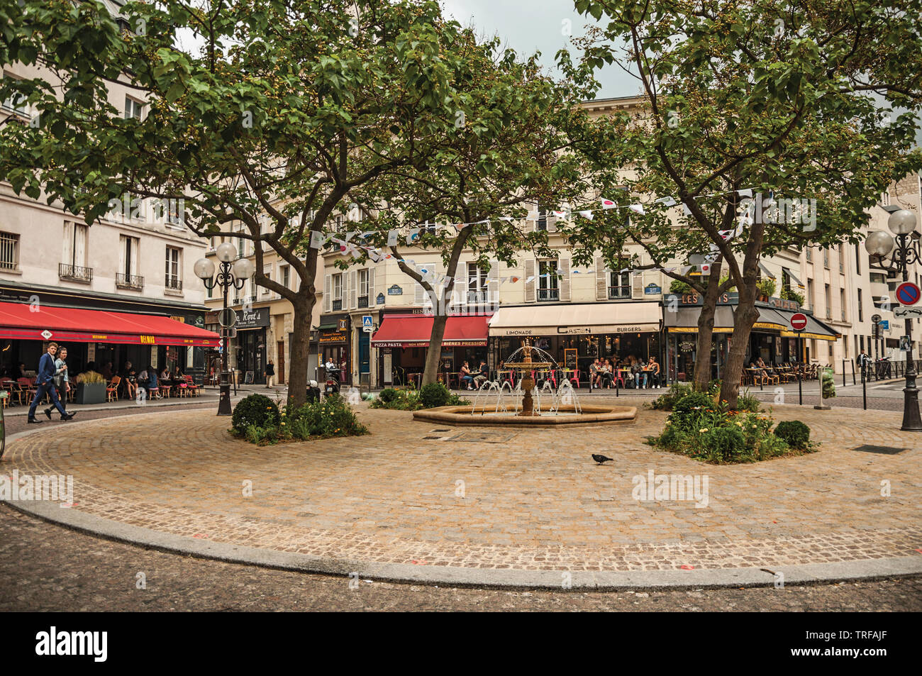Small square with fountain, trees and restaurants in the Quartier Latin ...
