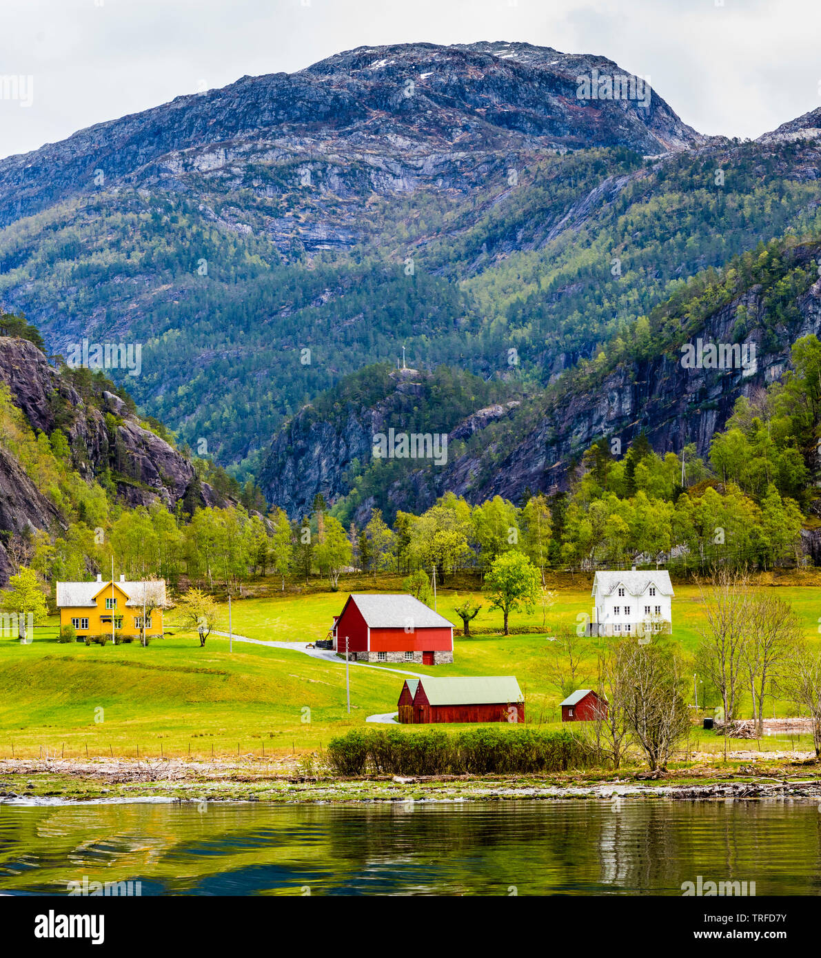 Sightseeing by boat to the narrow fjord at Mostraumen in Western Norway ...