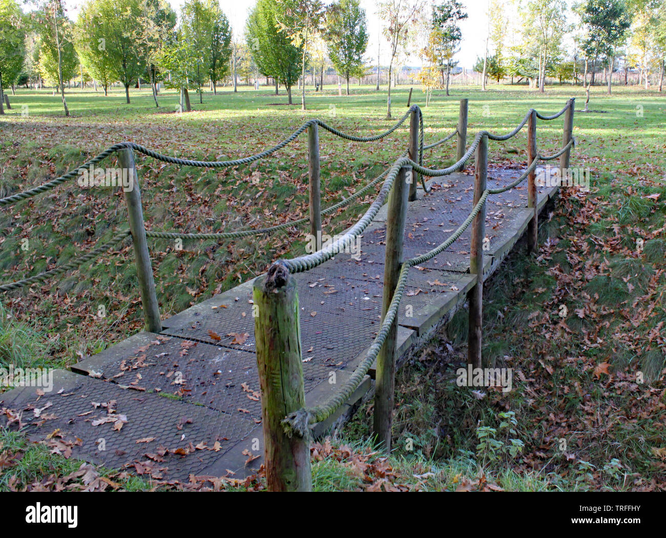 A small rope bridge crosses a ditch at Arley Arboretum in the Midlands ...