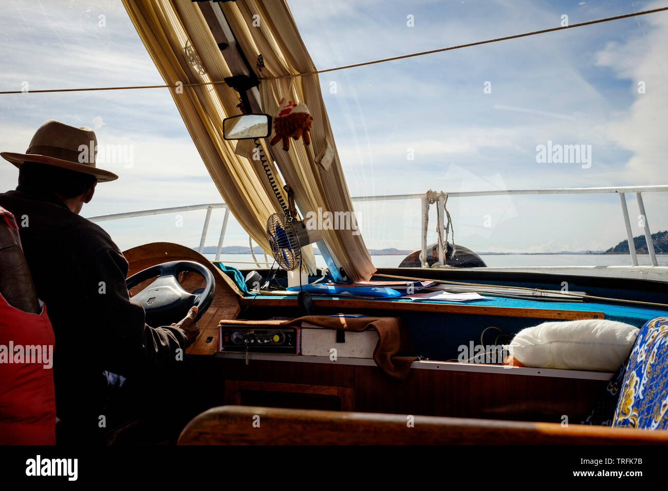 Boat captain ruling the tourist boat that take us on a tour on Lake ...