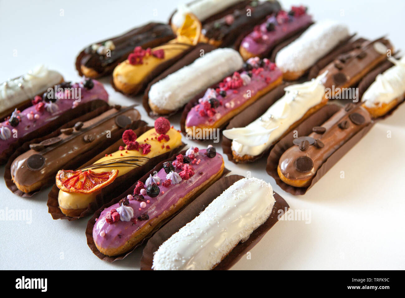 Set of several eclairs with various fillings and design isolate on a ...