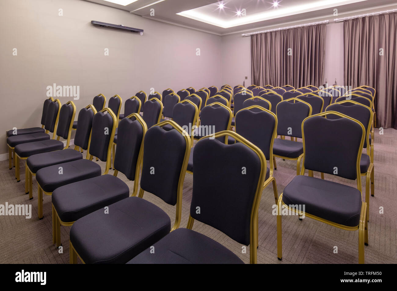 Seminar presentation. Empty conference room, lots of empty seats ...