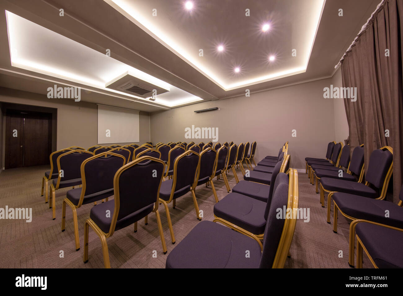 Seminar presentation. Empty conference room, lots of empty seats ...