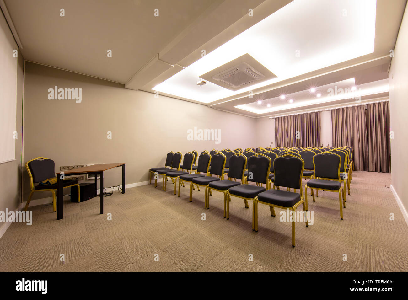 Seminar presentation. Empty conference room, lots of empty seats ...