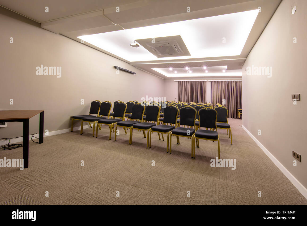 Seminar presentation. Empty conference room, lots of empty seats ...