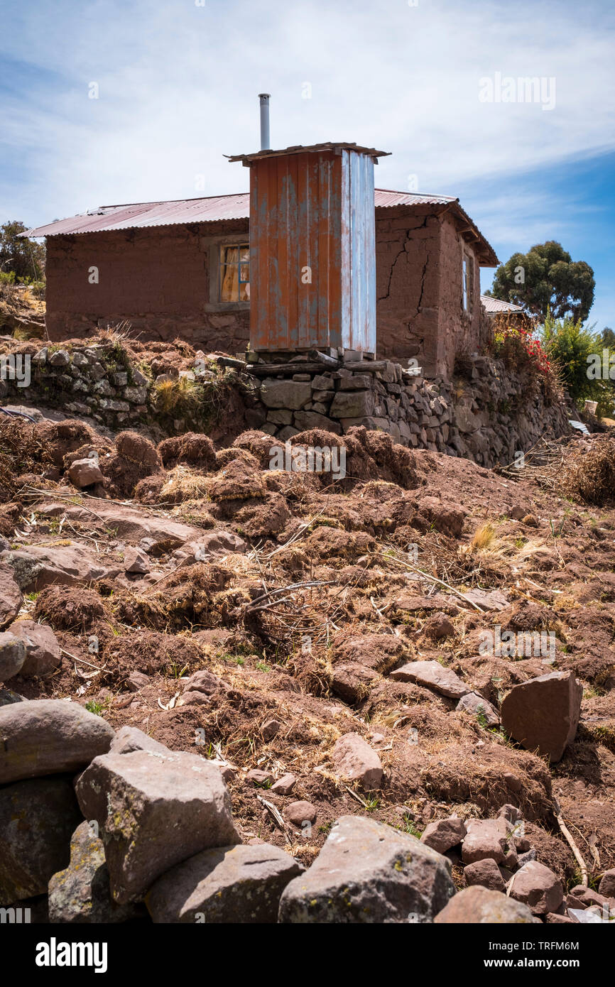 Exterior toilet hut on a house in Taquile Island hillside, Lake ...