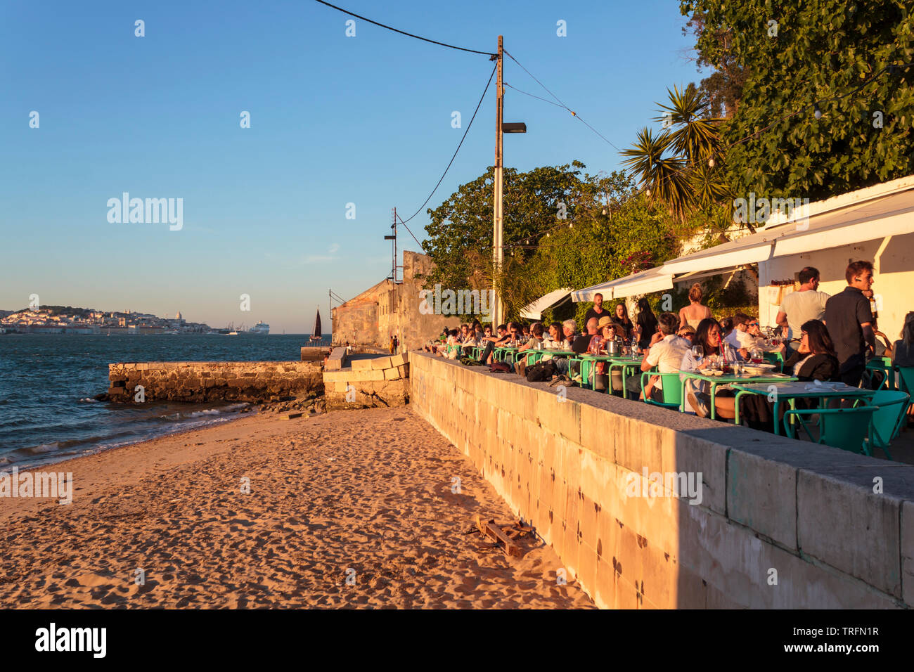 People eating in outdoor restaurant terrace at riverside Stock Photo ...