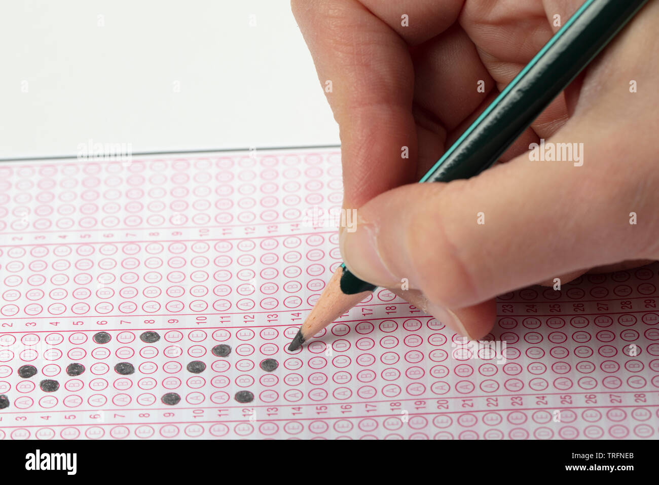 School Students hands taking exams, writing examination holding pencil ...