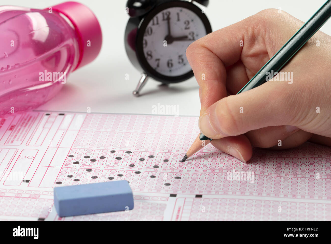 School Students hands taking exams, writing examination holding pencil ...