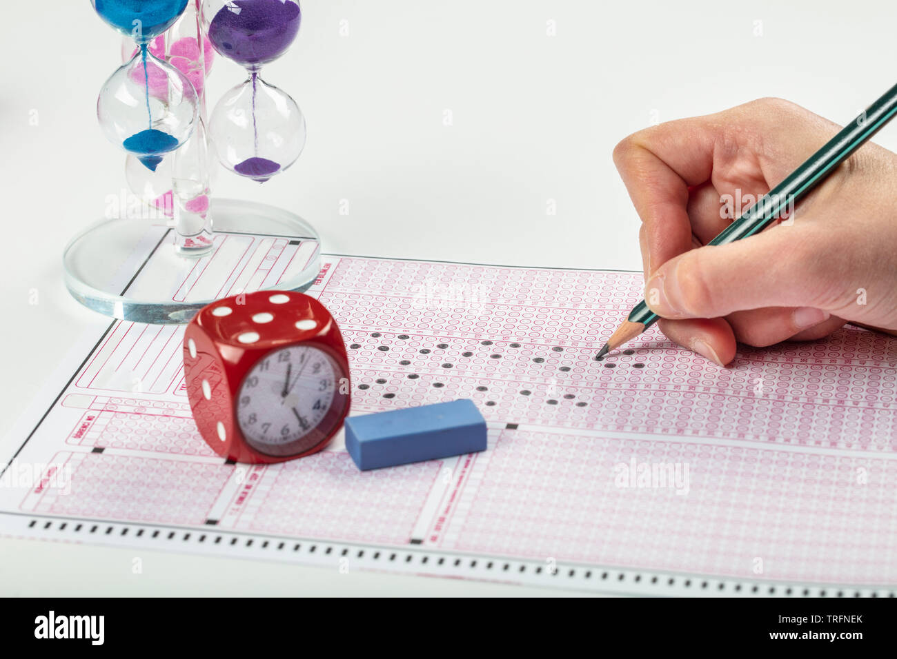 School Students hands taking exams, writing examination holding pencil ...