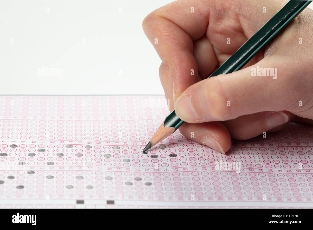 School Students hands taking exams, writing examination holding pencil ...