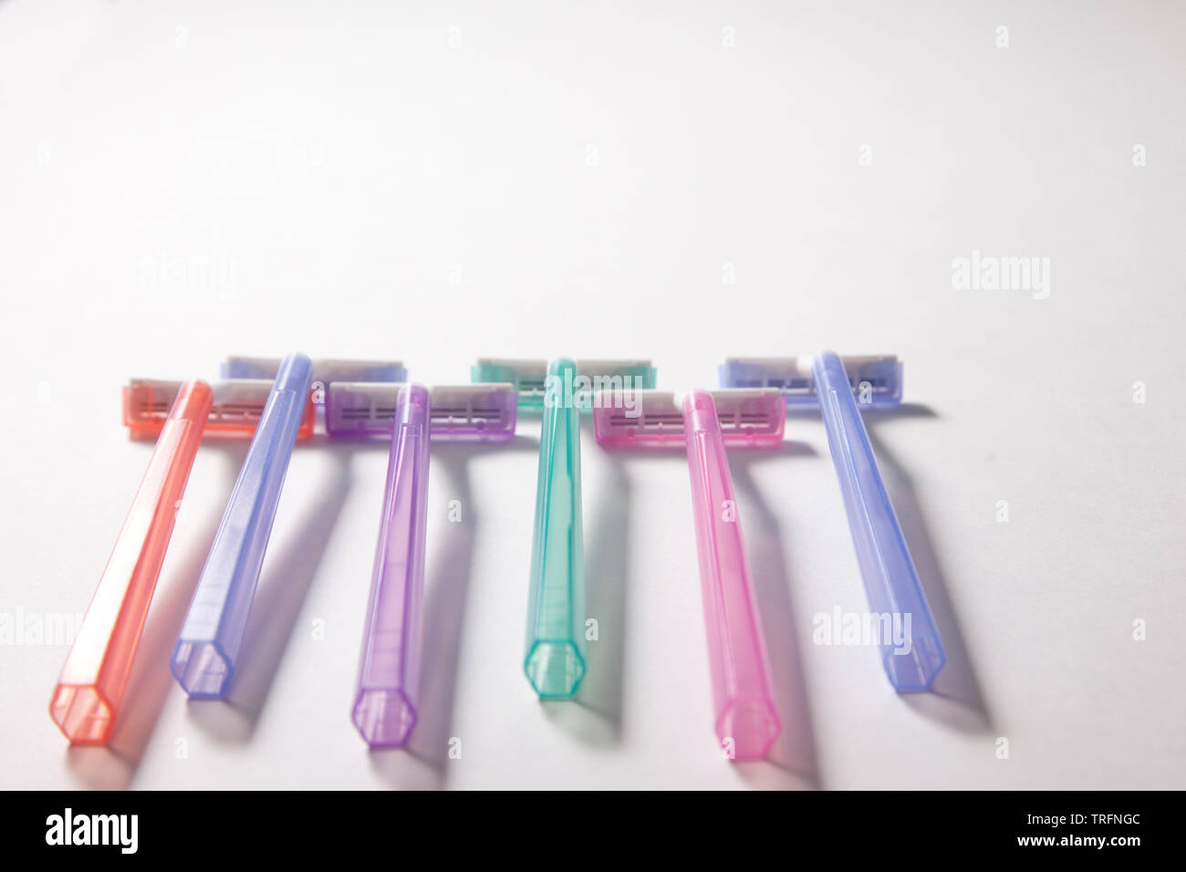 Set of pastel colored razors against a white background Stock Photo - Alamy