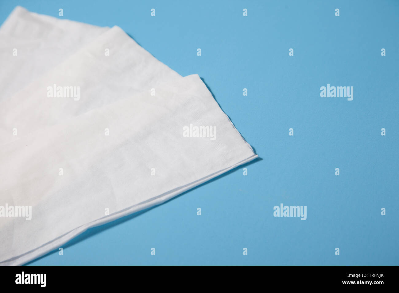 Three fresh tissues are ready for crying, a cold or nose blowing, white ...