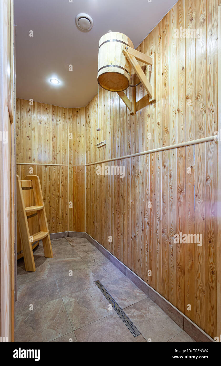 Cold water from a wooden bucket, for hardening and a healthy lifestyle ...