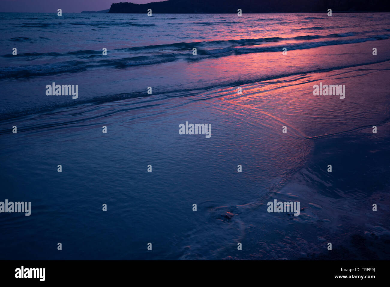 dark sea sandy beach and red sunlight sunset twilight ocean background ...