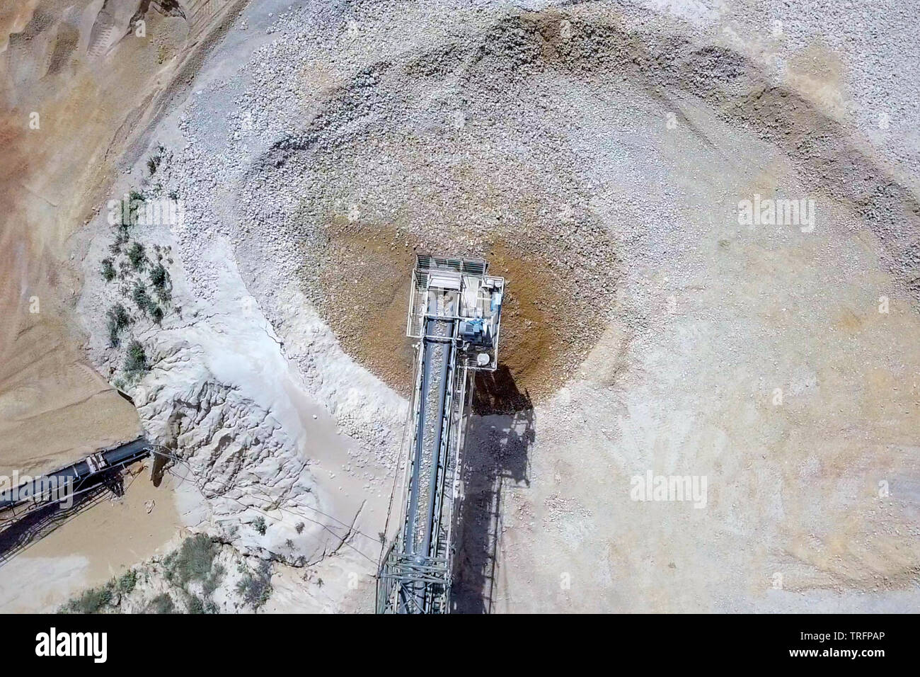 Large Quarry during work hours with Stone sorting conveyor belts ...