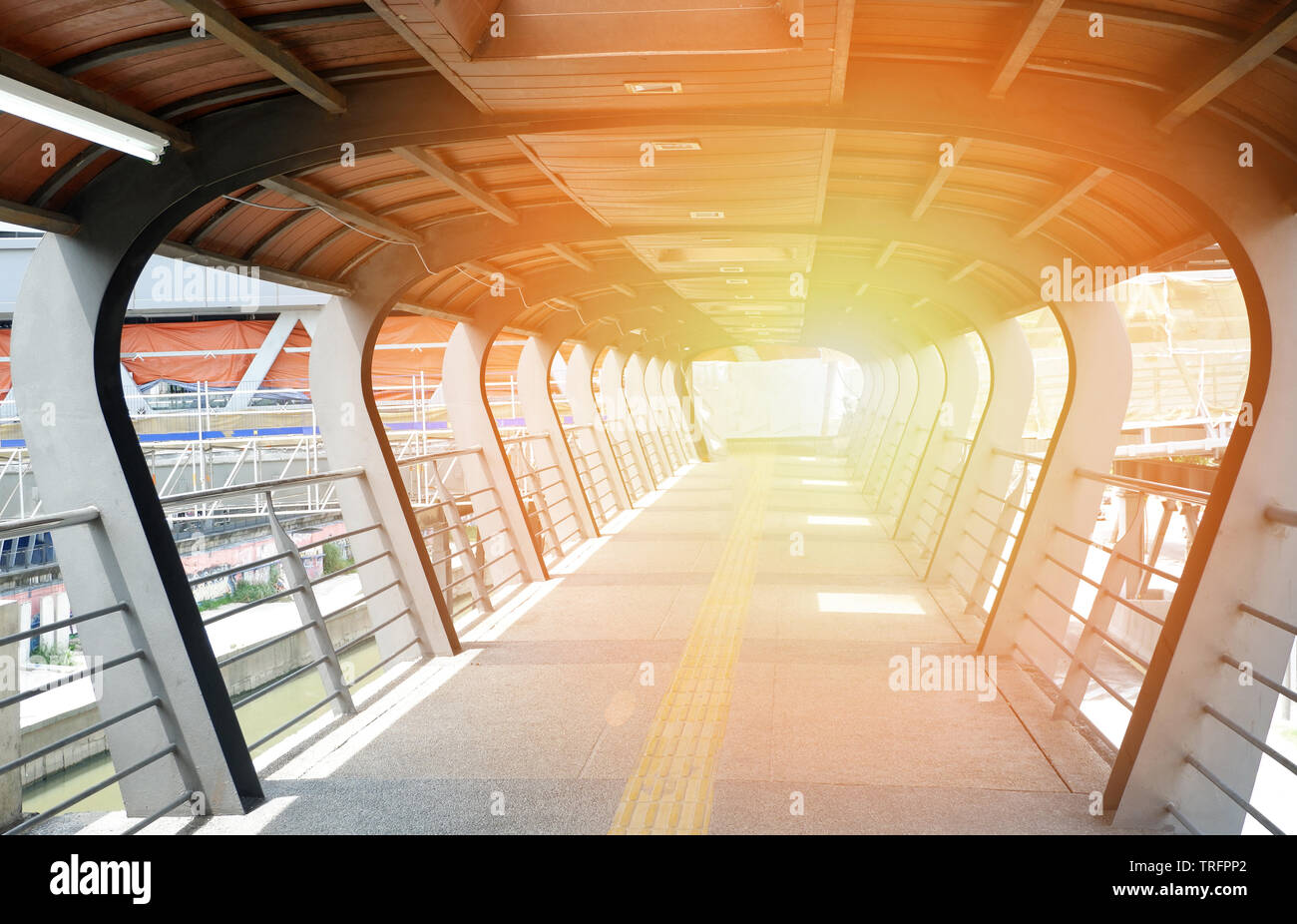 pedestrian overpass / modern footbridge overpass crossing on traffic ...