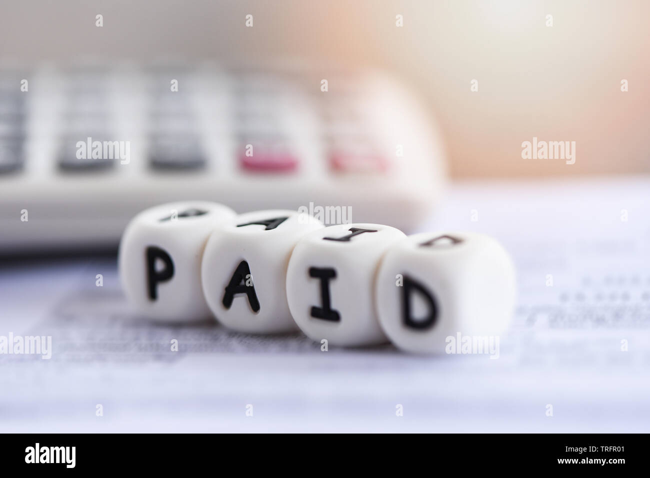 Paid Words And Calculator On Invoice Bill Paper For Time Paid Payment paid-words-and-calculator-on-invoice-bill-paper-for-time-paid-payment