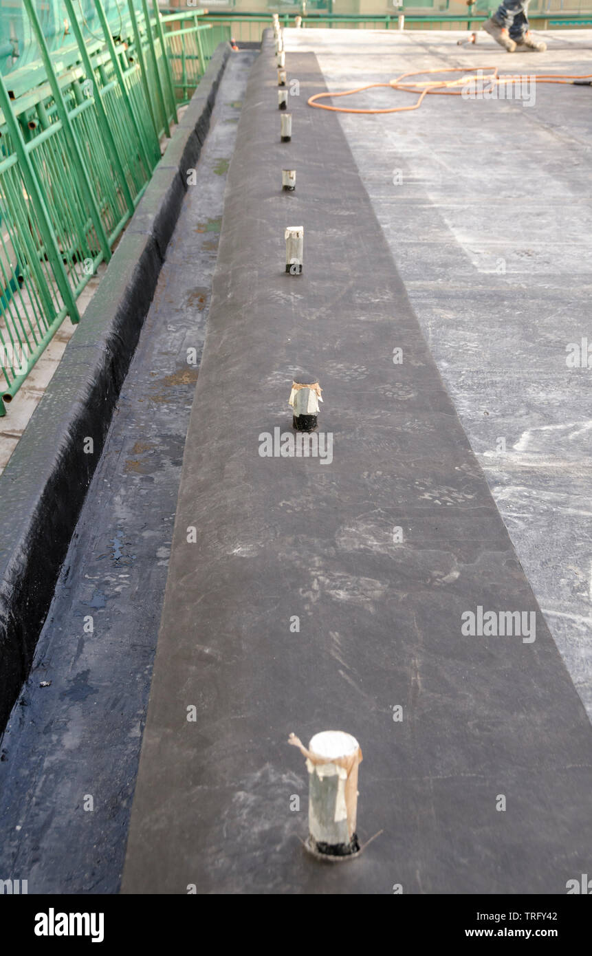 construction work during the renovation of a roof of a building with ...