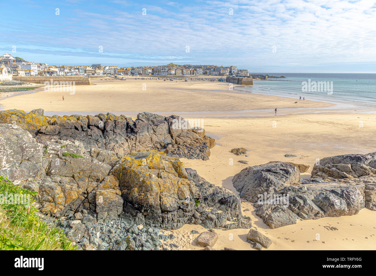 St Ives seaside town in Cornwall, England with seal wall, harbour, town ...