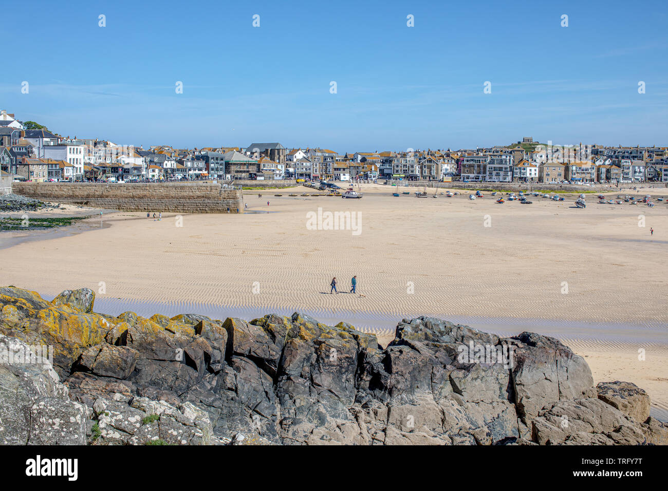 St Ives seaside town in Cornwall, England with seal wall, harbour, town ...