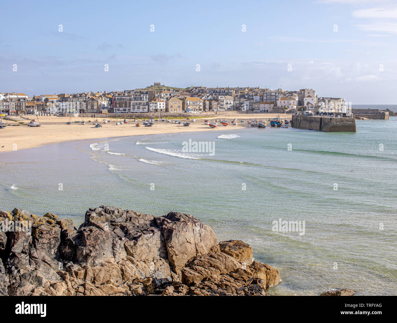 St Ives seaside town in Cornwall, England with seal wall, harbour, town ...