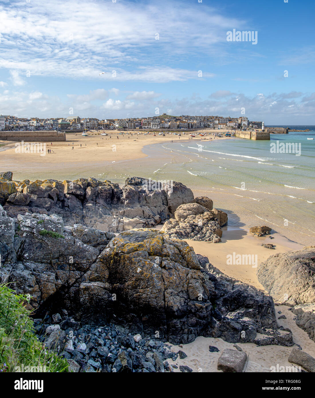 St Ives seaside town in Cornwall, England with seal wall, harbour, town ...