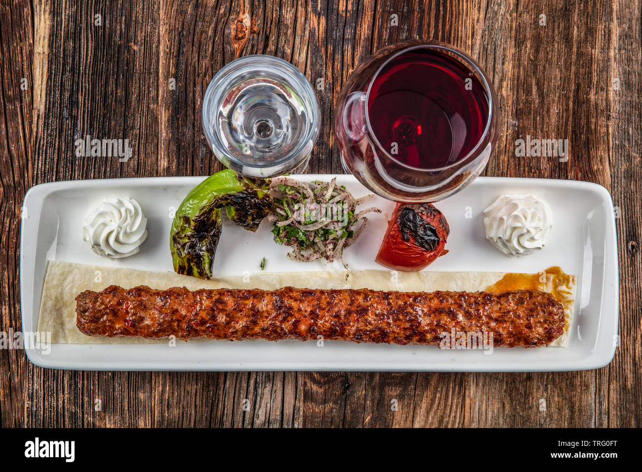 Minced lamb kebab with vegetables ( Turkish Cuisine Adana Kebab Stock ...