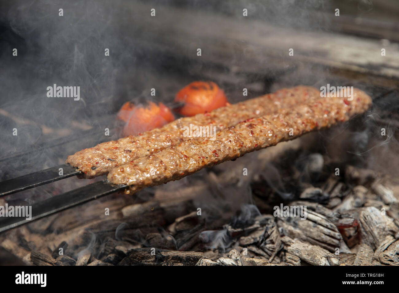 Kebab or kebap on metal skewer barbecue in the kebap restaurant ...