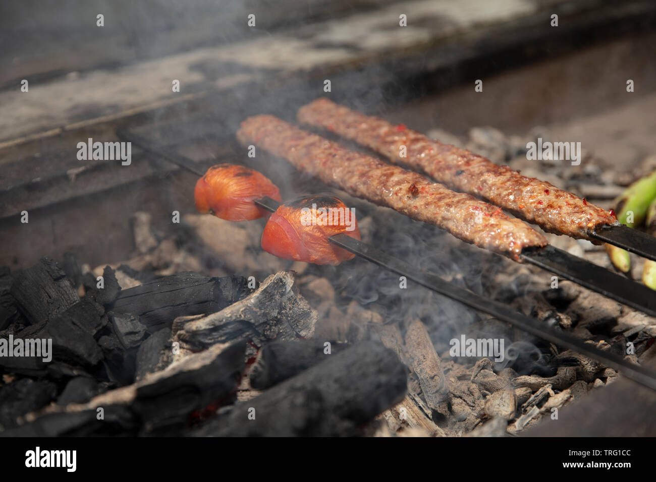 Kebab or kebap on metal skewer barbecue in the kebap restaurant ...