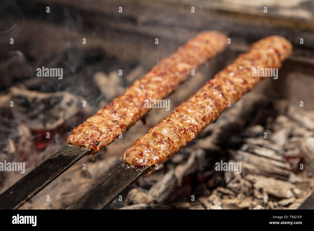 Kebab or kebap on metal skewer barbecue in the kebap restaurant ...