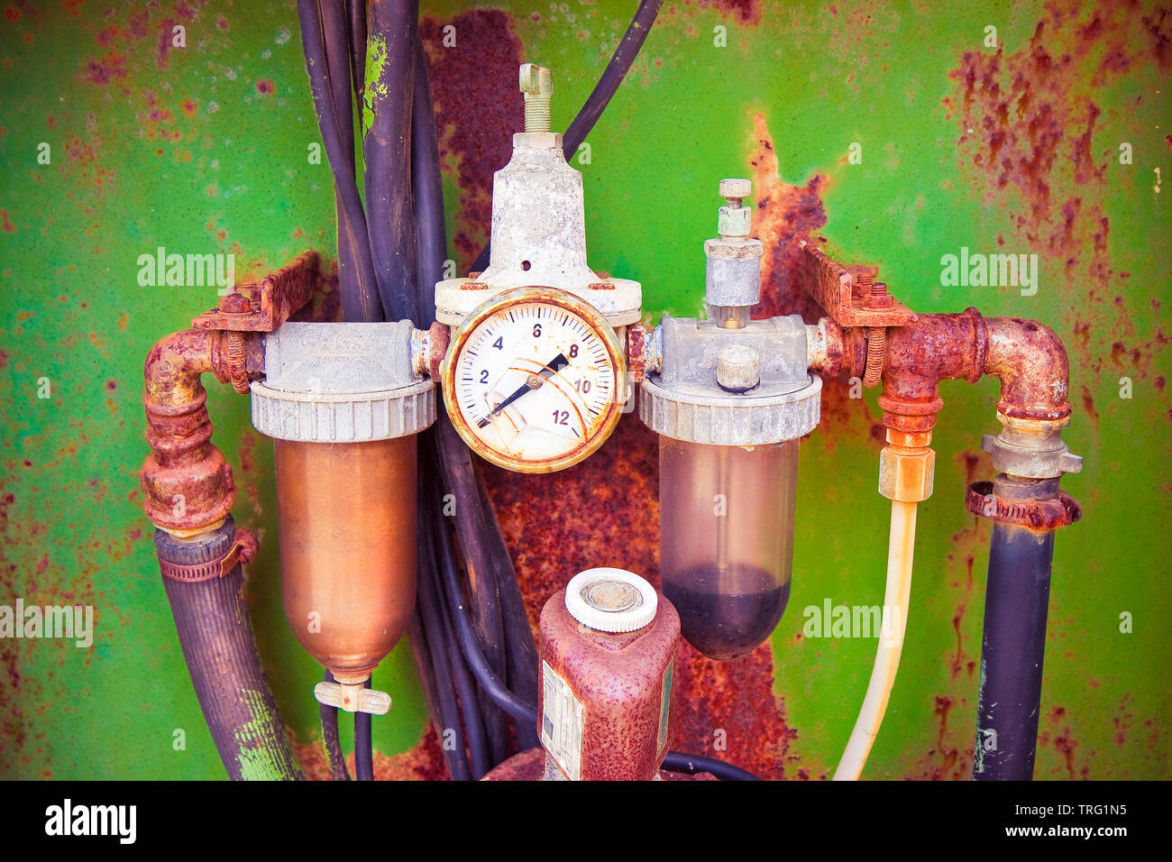 Old rusty disused manometer on colored background Stock Photo - Alamy