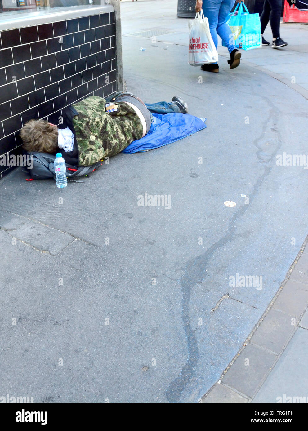 London, England, UK. Homeless man on the street in the Strand Stock ...