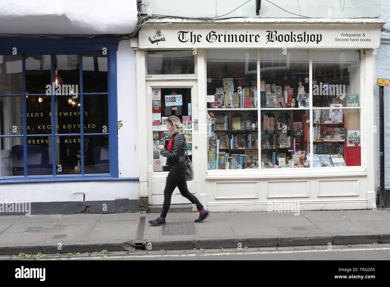 Antique bookstore woman hi-res stock photography and images - Alamy