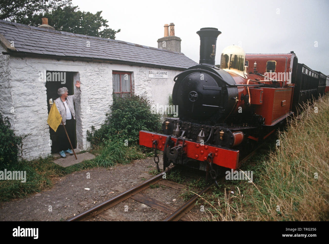 Isle of Man Railway Ballygawne Crossing keeper waving at steam ...