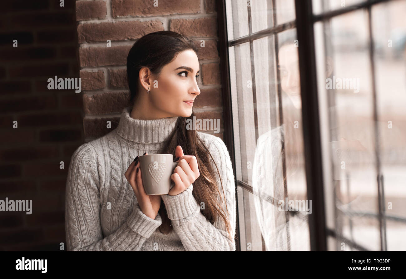 Girl posing in window hi-res stock photography and images - Alamy