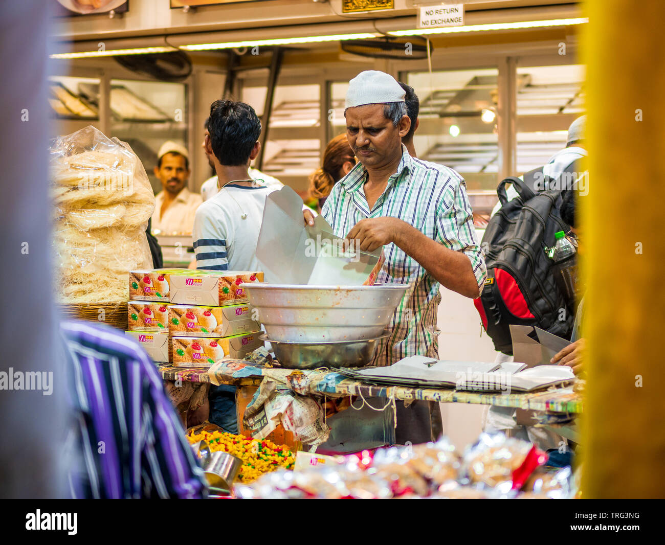 Mumbai, India - June 01, 2019 : Muslim male vendors packing sweets at ...