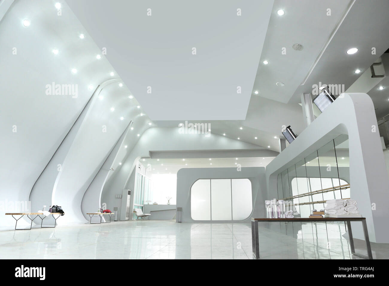 a loft white fitness studio from point of view to see the ceiling and ...