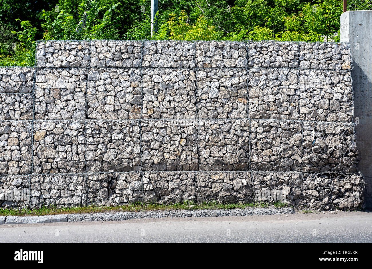 Protection fence or wall made of gabions with stones. Stone wall with ...